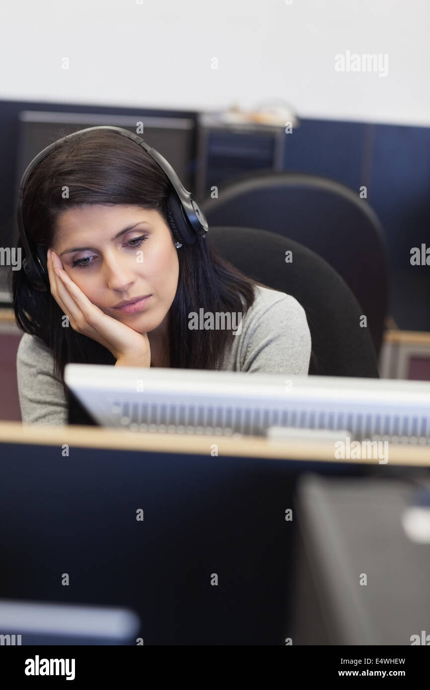 Tired woman in computer room Stock Photo - Alamy