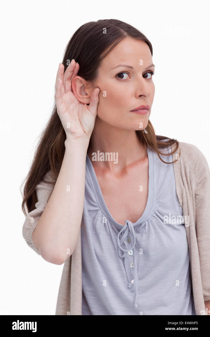 Close up of woman listening closely Stock Photo - Alamy