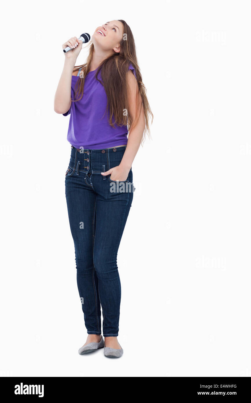 Teenager raising her head while singing Stock Photo - Alamy