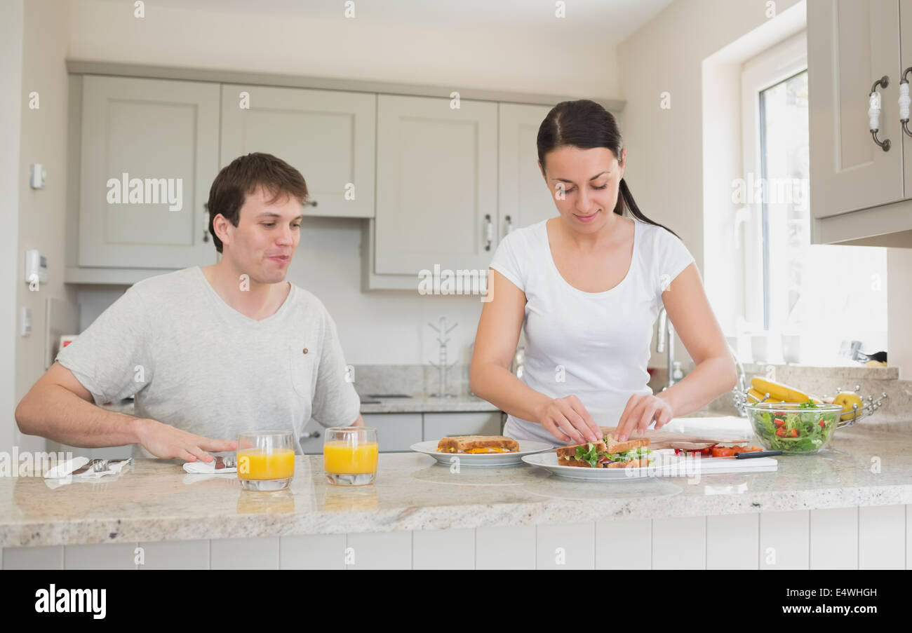 Two young people having lunch Stock Photo - Alamy