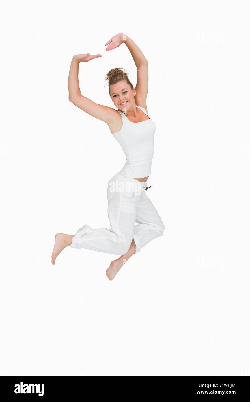 Fit blonde jumping smiling camera hi-res stock photography and images ...