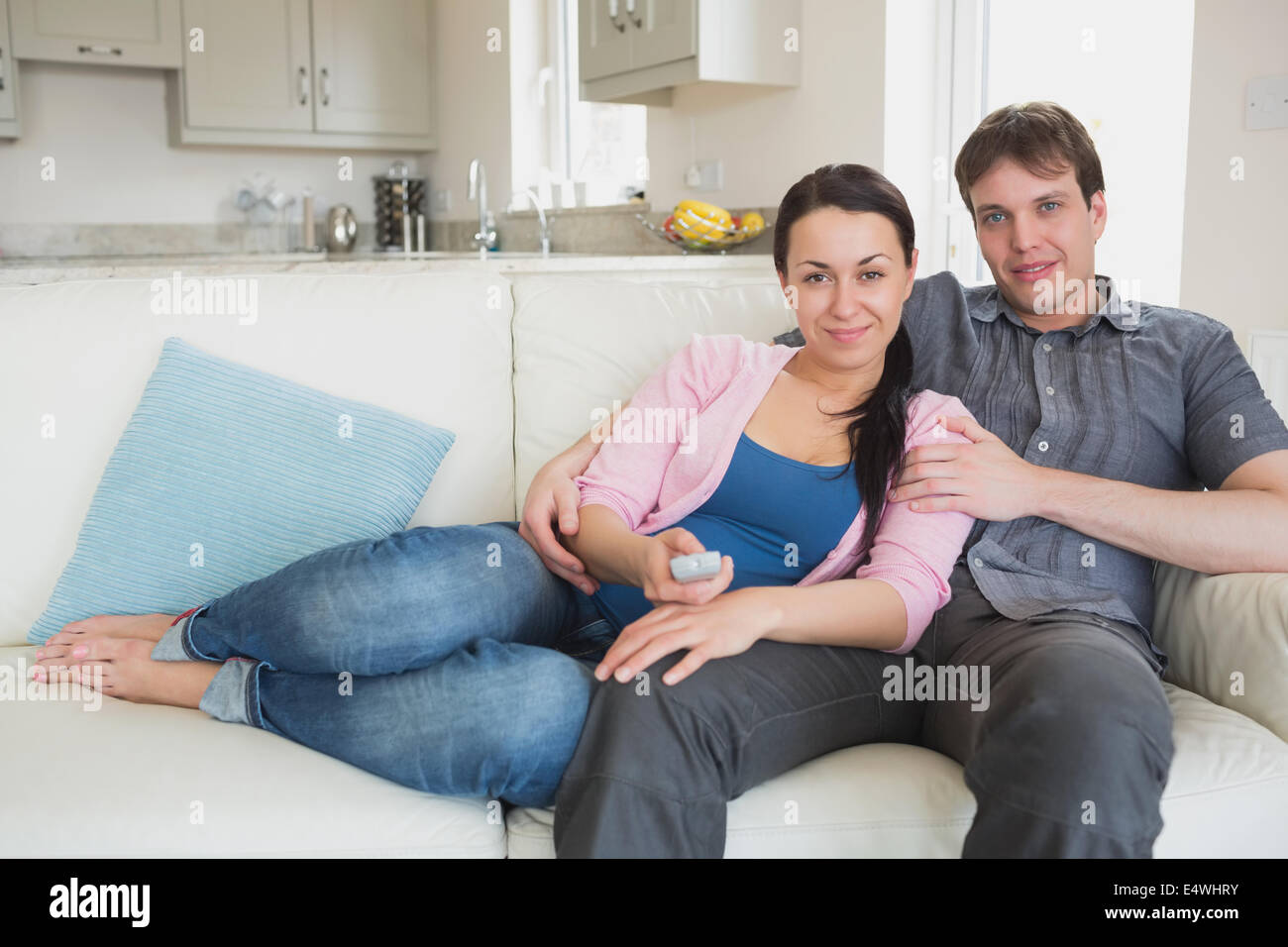 Two people relaxing in the living room Stock Photo - Alamy
