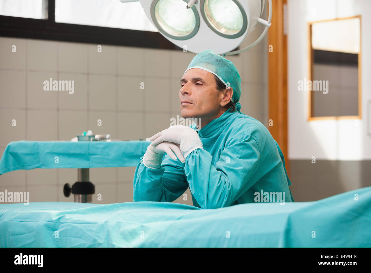 Surgeon sitting in operating room hi-res stock photography and images ...