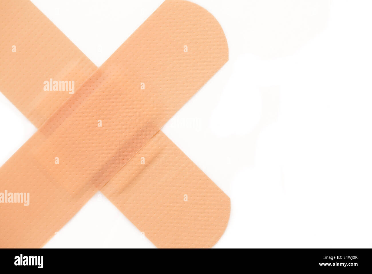 Close-up of two plasters Stock Photo - Alamy