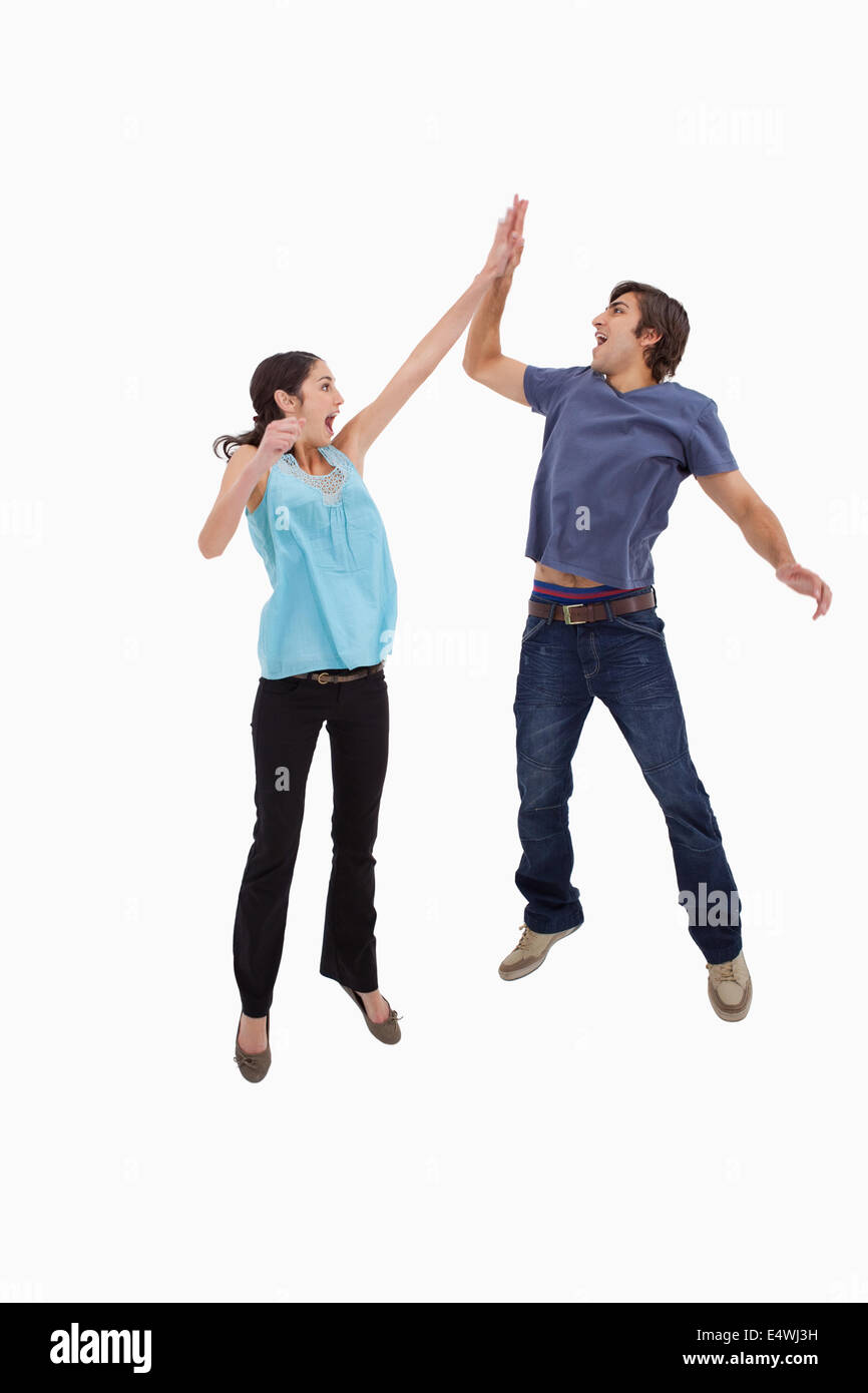 Excited couple celebrating raised hi-res stock photography and images ...