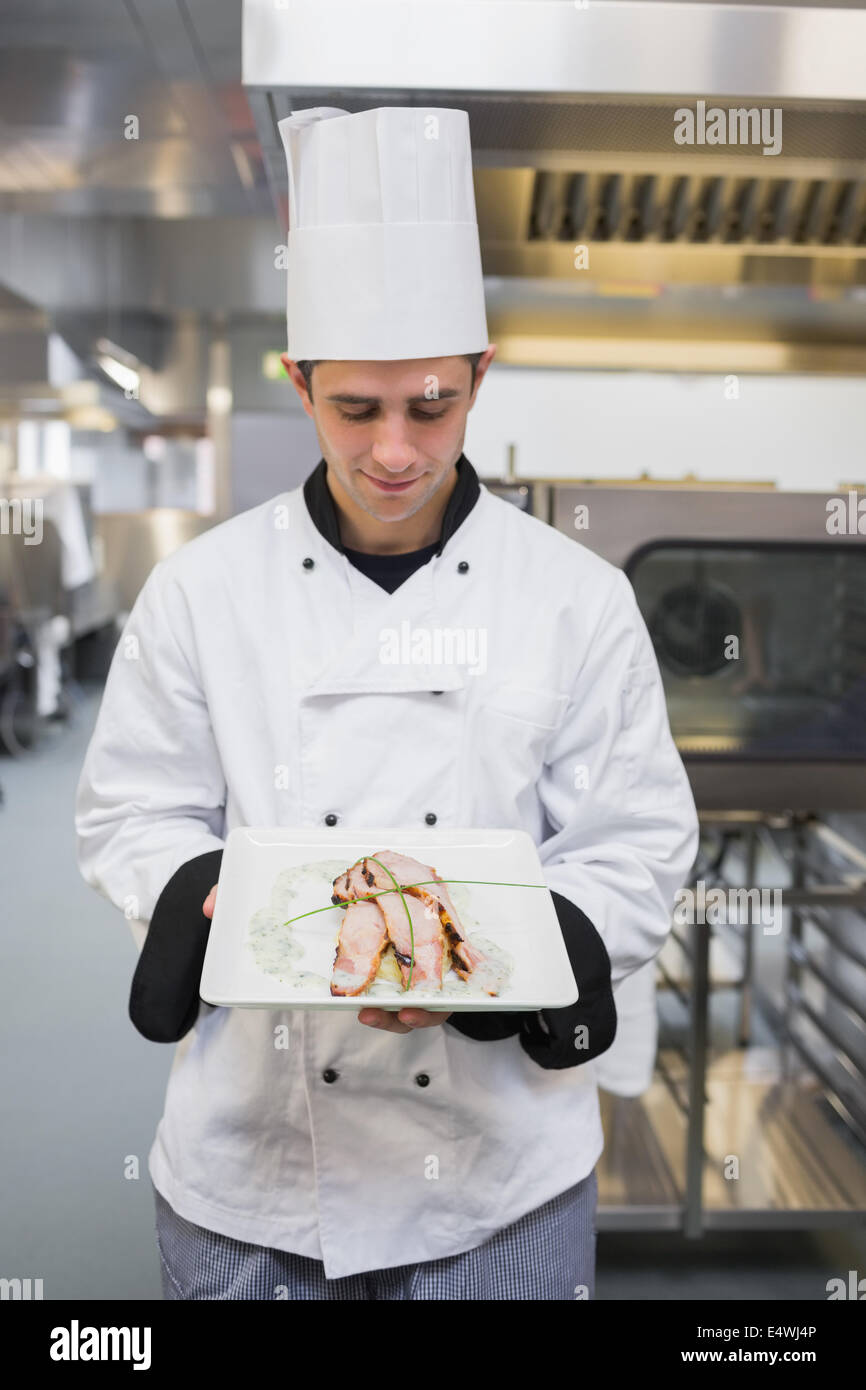 Chef looking down at his dish Stock Photo - Alamy