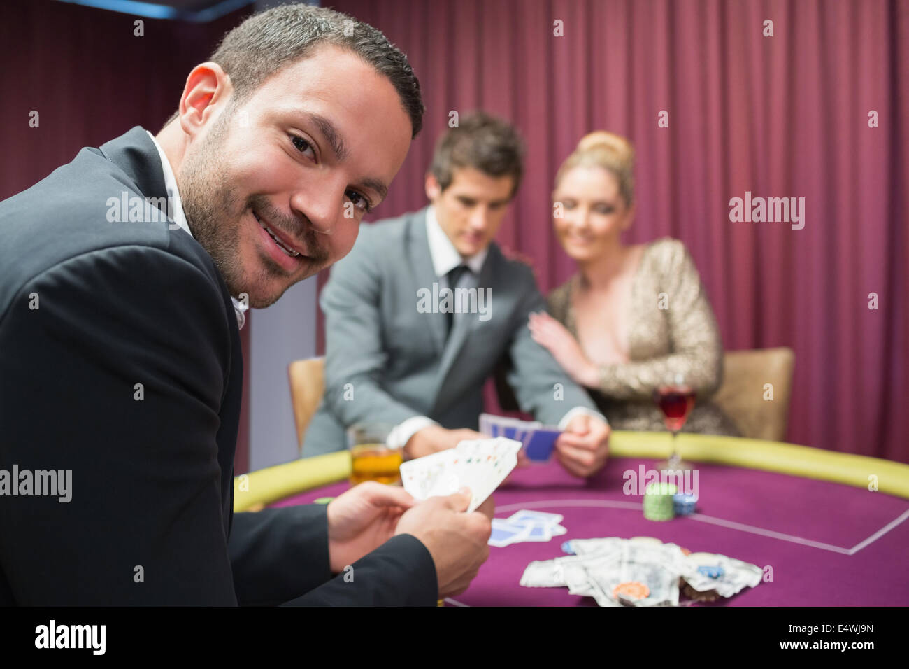 Smiling gambler hi-res stock photography and images - Alamy