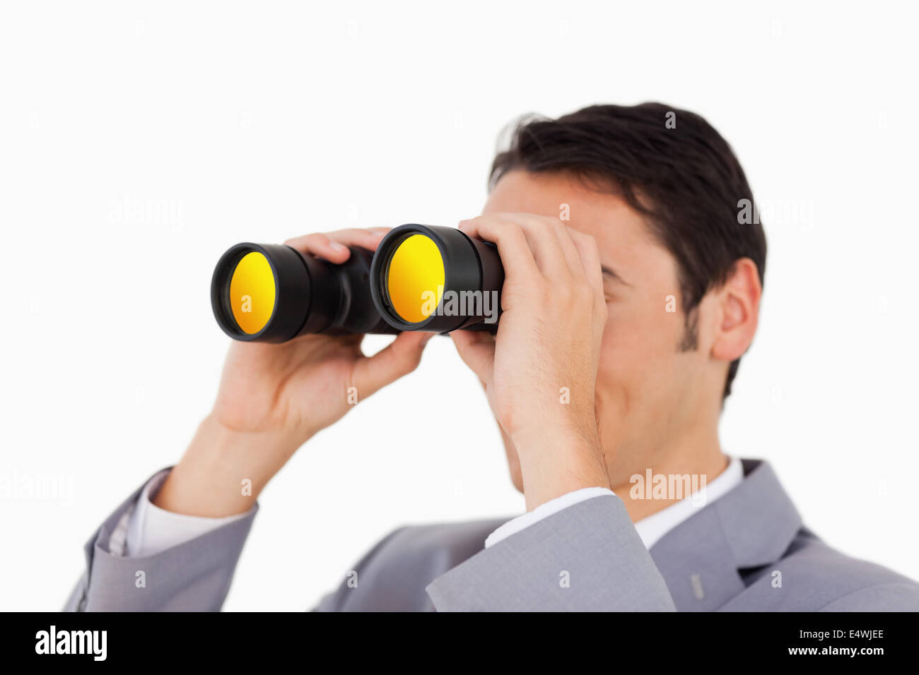 Man in a suit using binoculars Stock Photo - Alamy