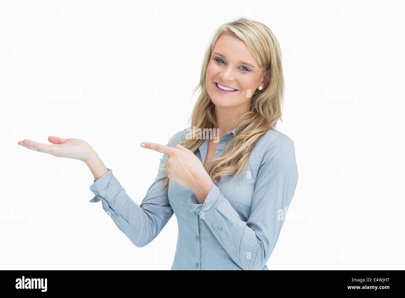 Woman pointing at her hand Stock Photo - Alamy