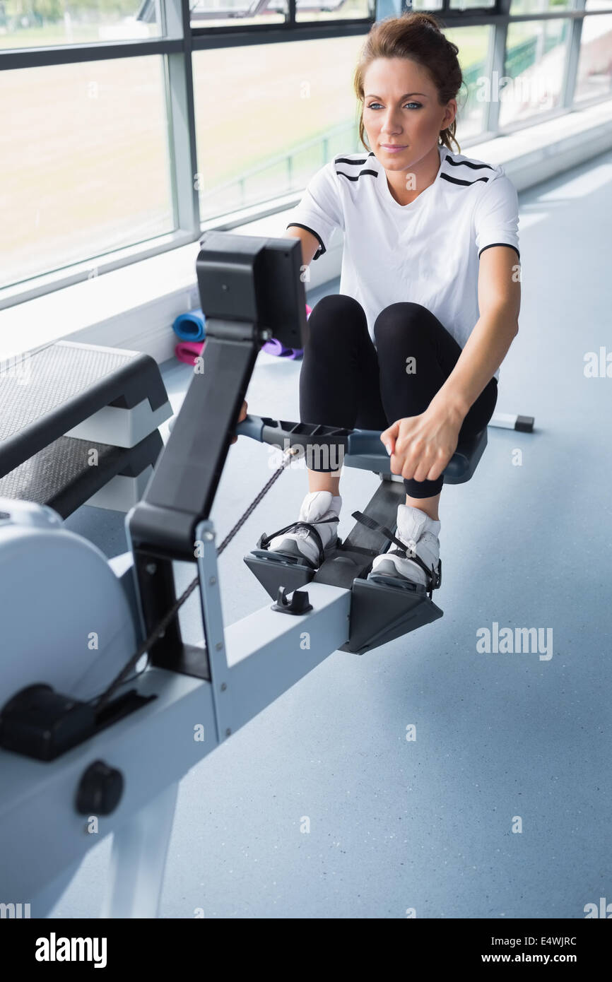 Female on rowing machine hi-res stock photography and images - Alamy
