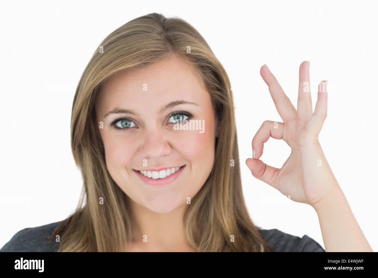 Woman making hand sign Stock Photo - Alamy