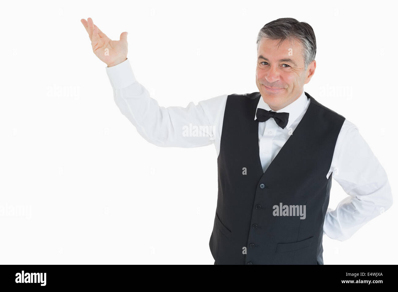Smiling man pointing to something Stock Photo - Alamy
