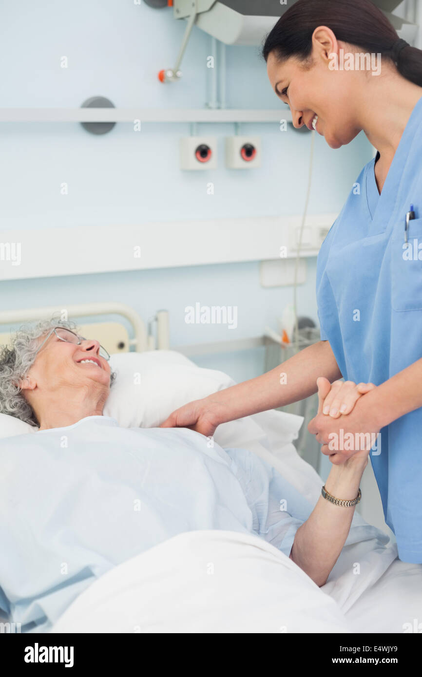 Nurse and a patient smiling Stock Photo - Alamy