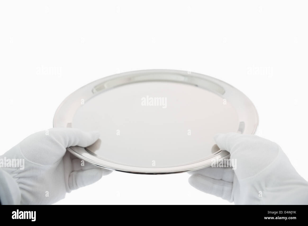 Gloved hands holding silver tray Stock Photo - Alamy