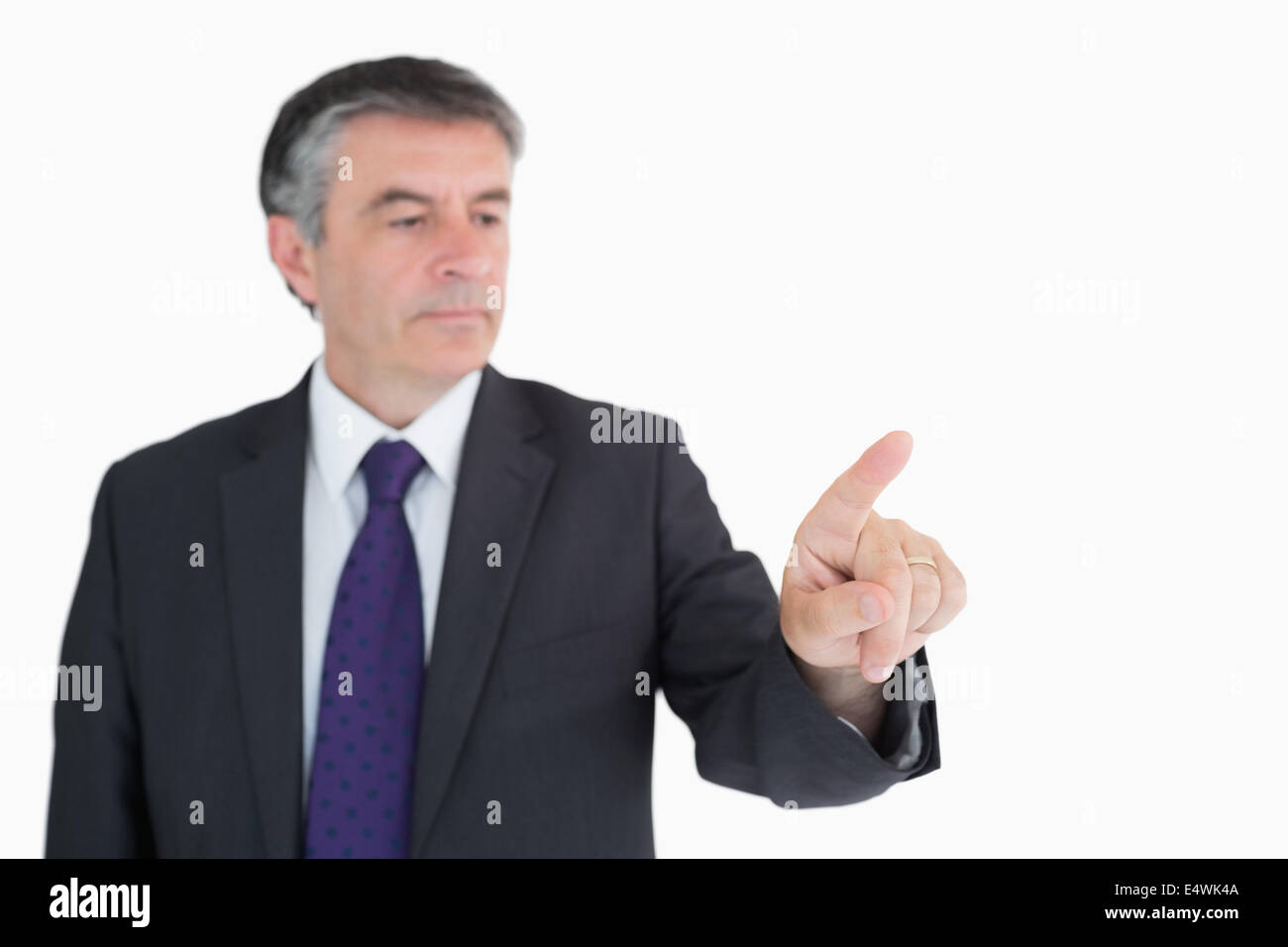 Businessman pressing on something Stock Photo - Alamy