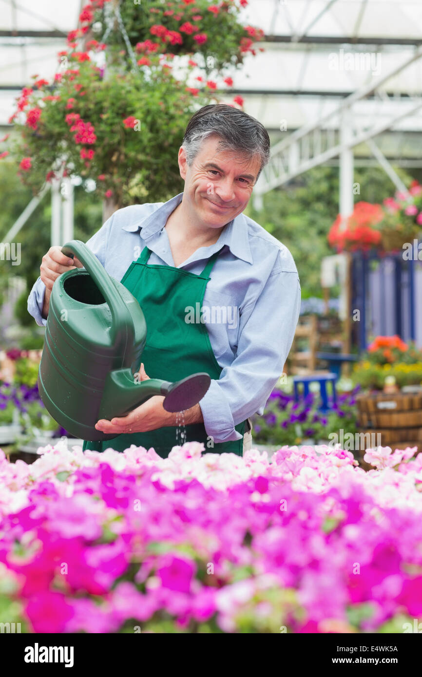 Man watering plants Stock Photo - Alamy