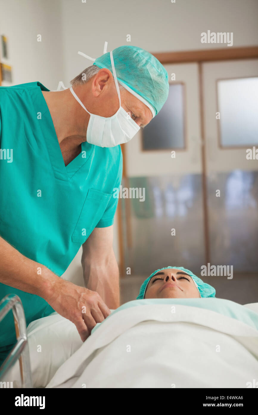 Surgeon touching a patient Stock Photo - Alamy