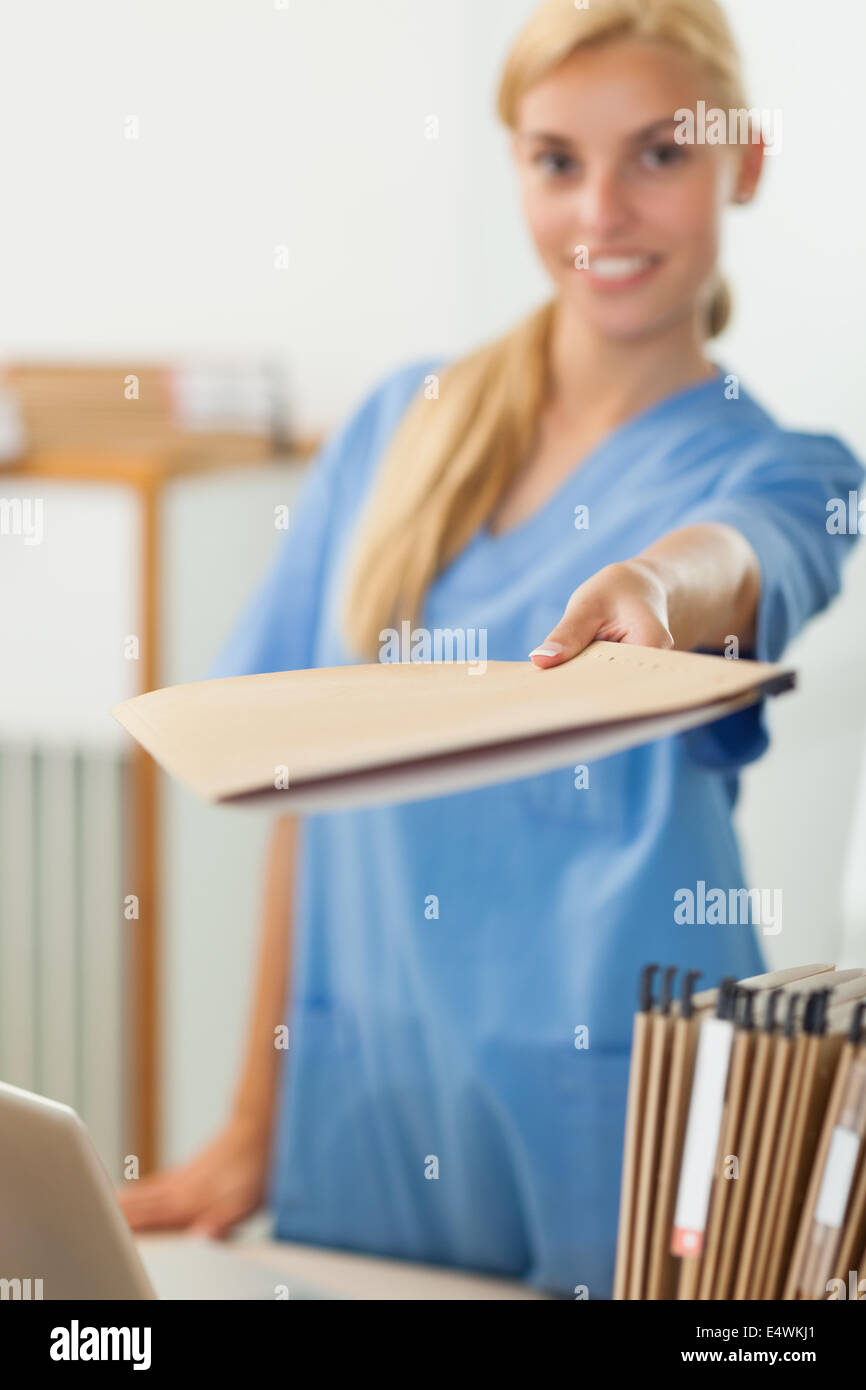 Nurse holding a file Stock Photo - Alamy