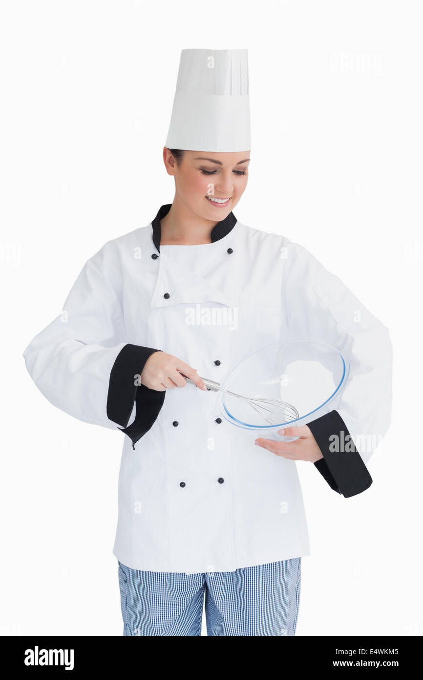 Smiling cook using whisk and bowl Stock Photo - Alamy