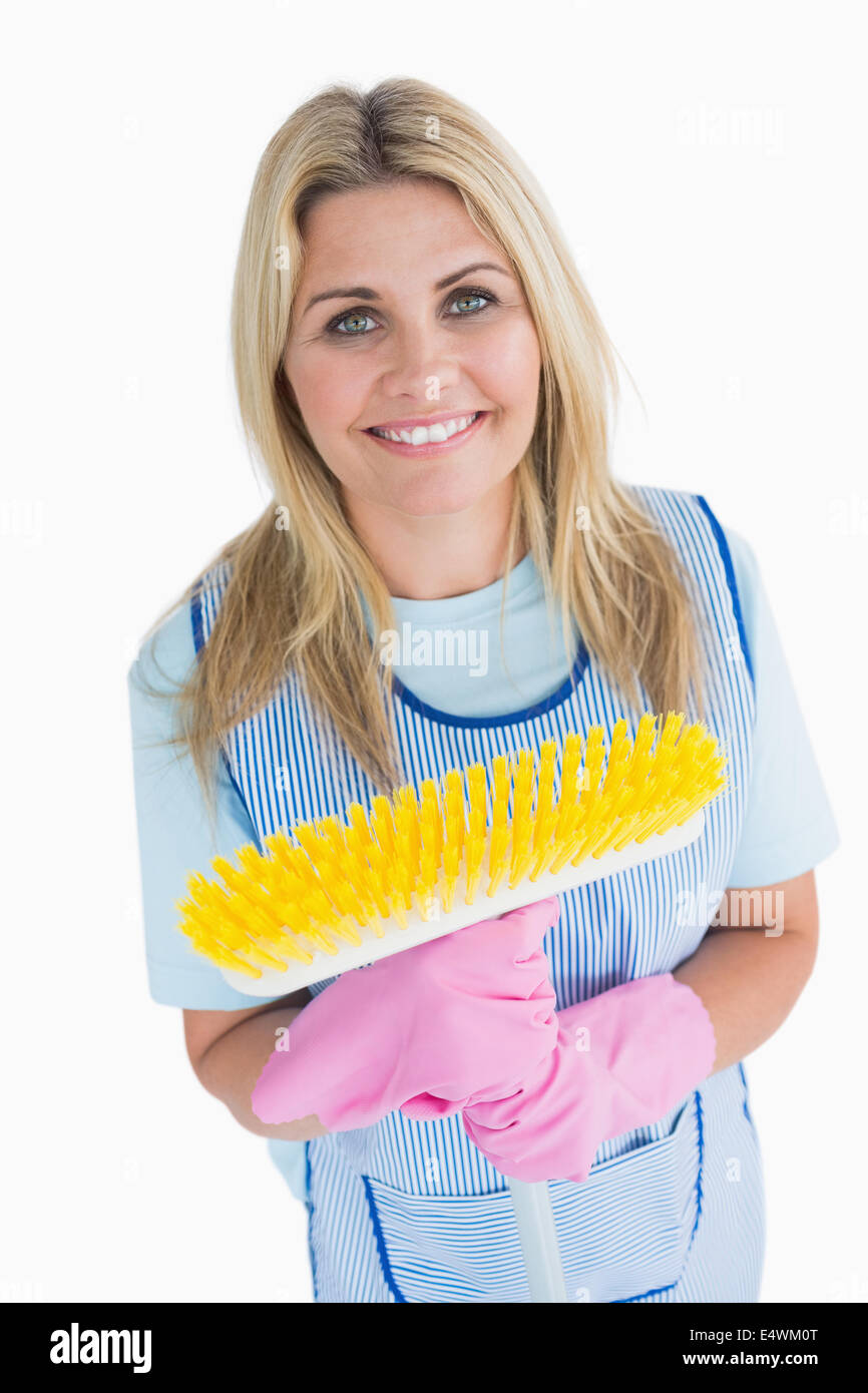 Happy woman holding broom hi-res stock photography and images - Alamy