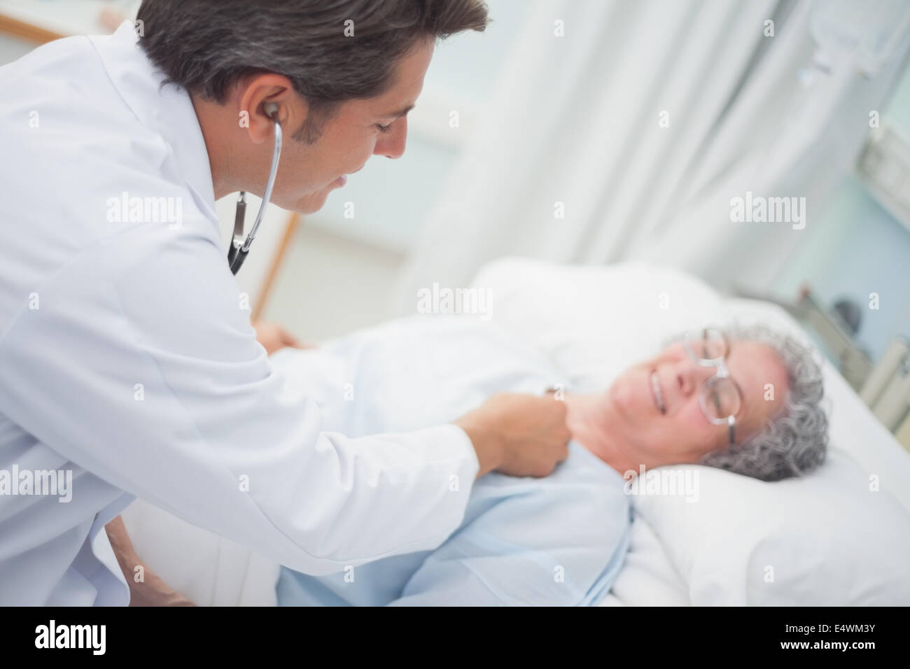 Patient is auscultating with a doctor Stock Photo - Alamy