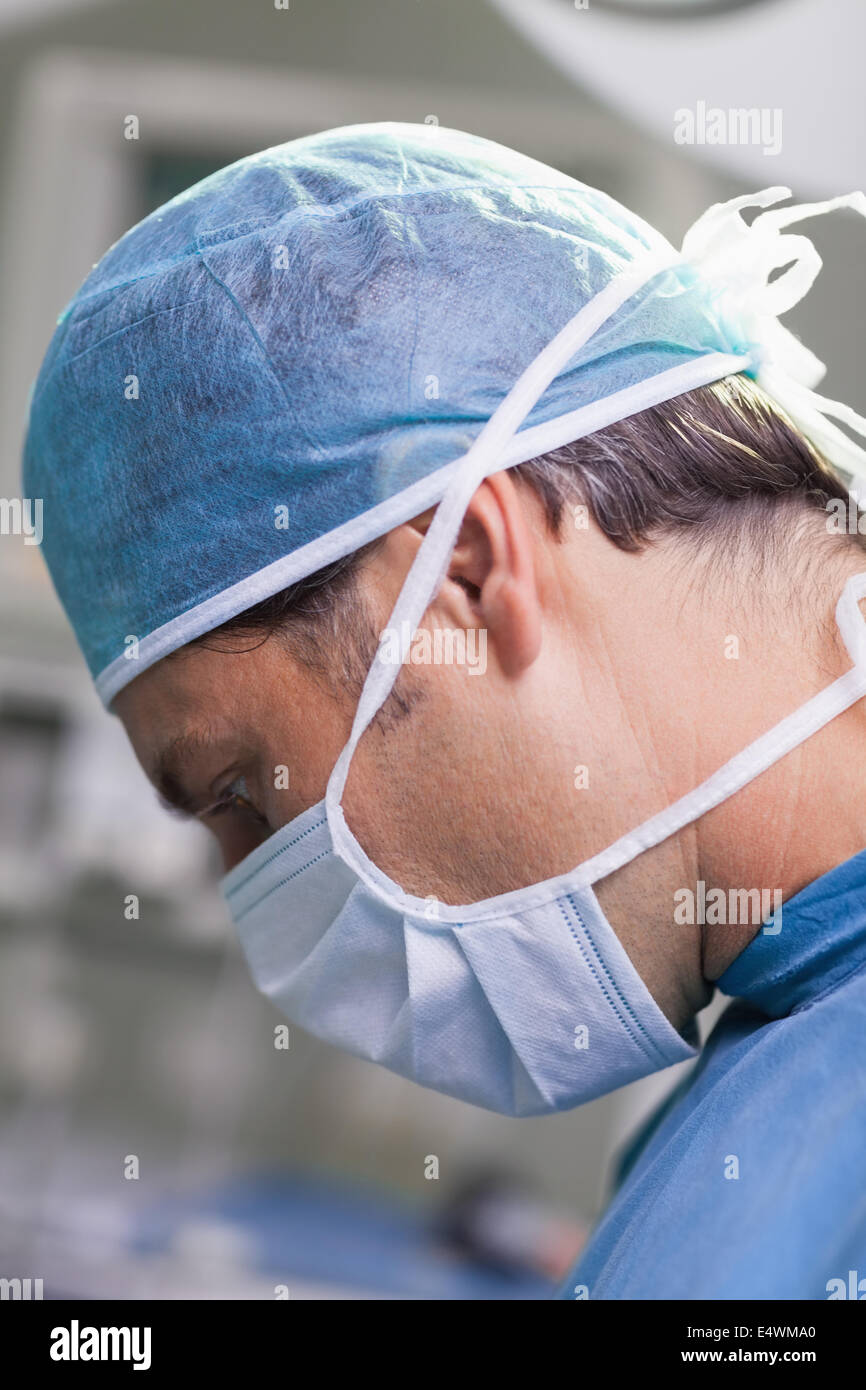 Serious doctor performing surgery Stock Photo - Alamy