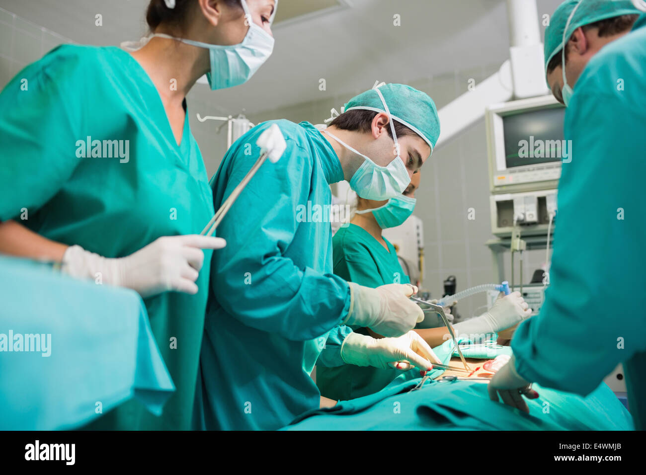 Surgeon using surgical tool Stock Photo - Alamy