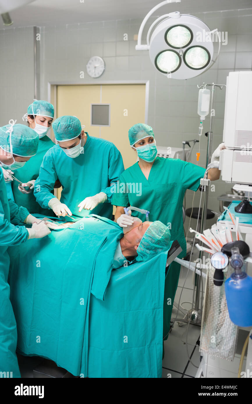Nurse adjusting a monitor Stock Photo - Alamy