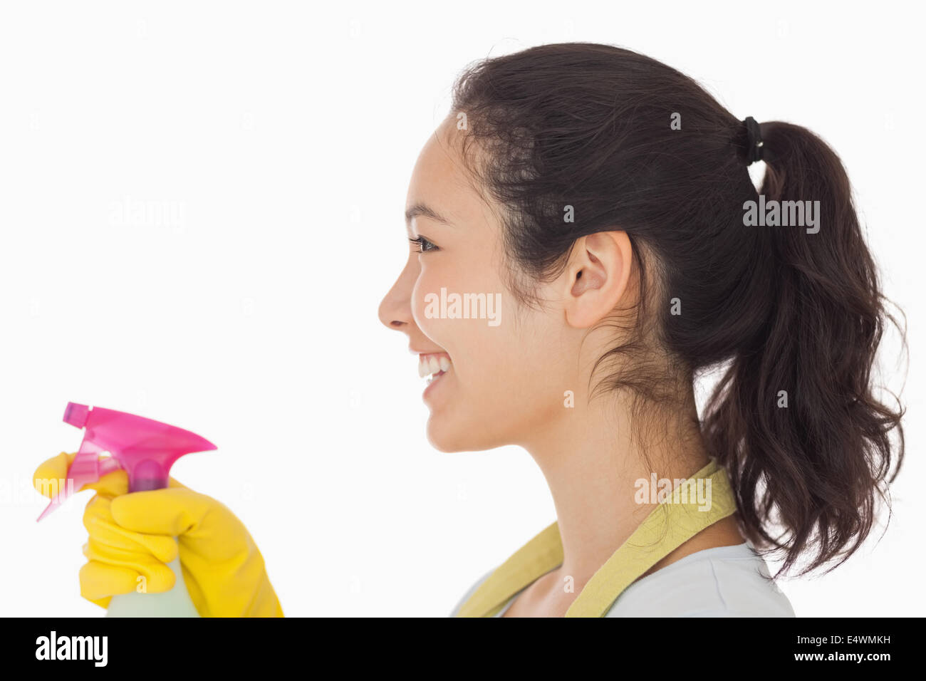 Cheerful woman using a window cleaner Stock Photo - Alamy