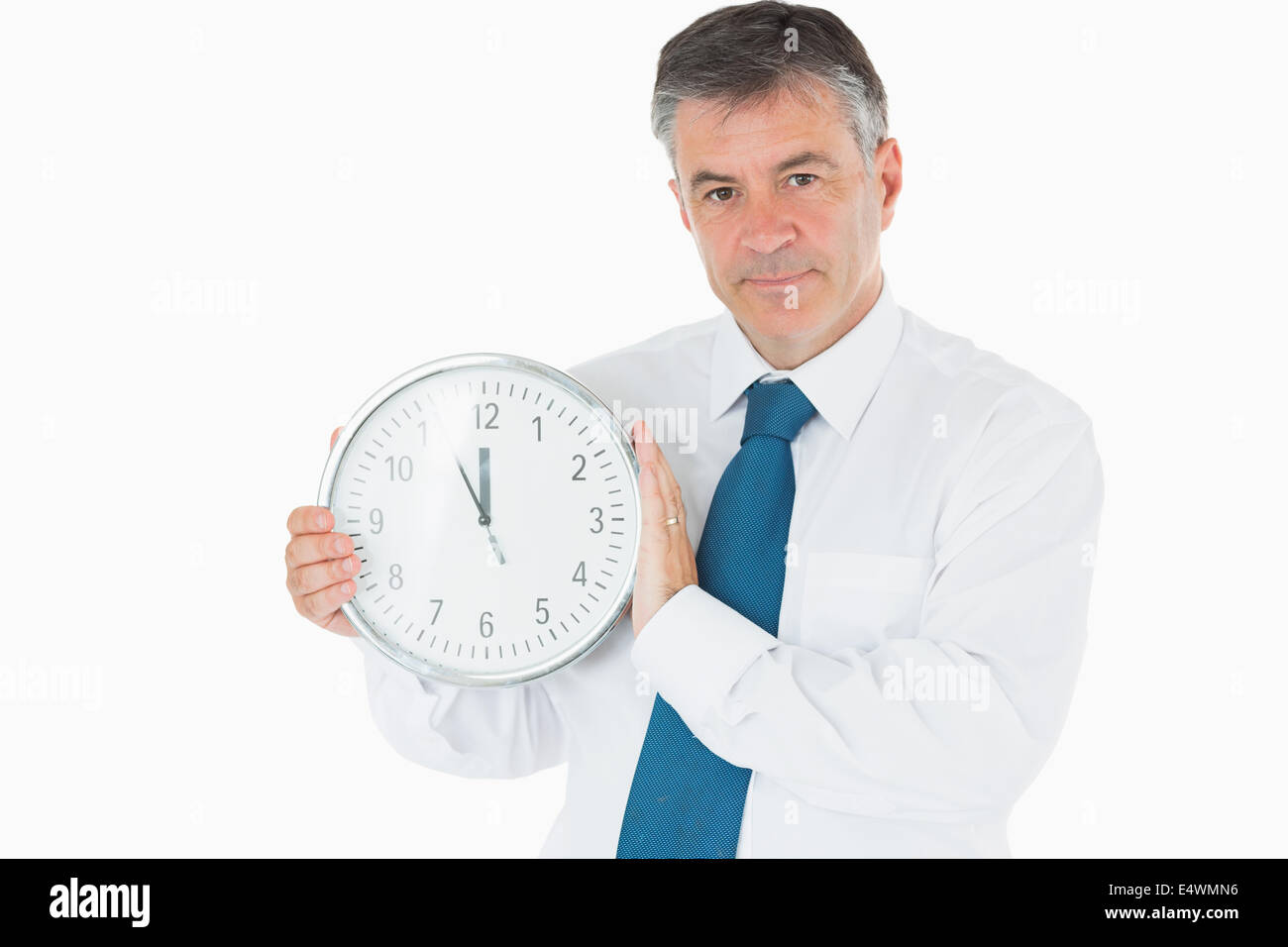 Businessman holding clock Stock Photo - Alamy