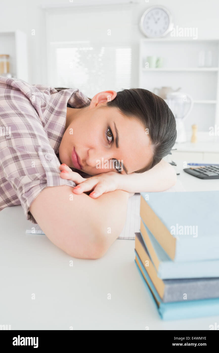 Woman resting on table Stock Photo - Alamy