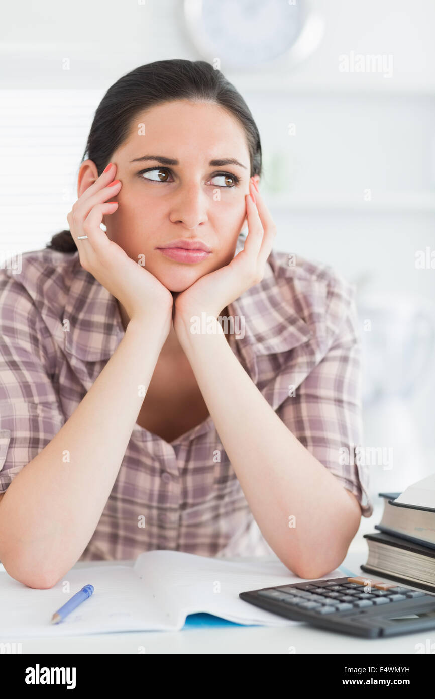 Sad young woman calculator hi-res stock photography and images - Alamy