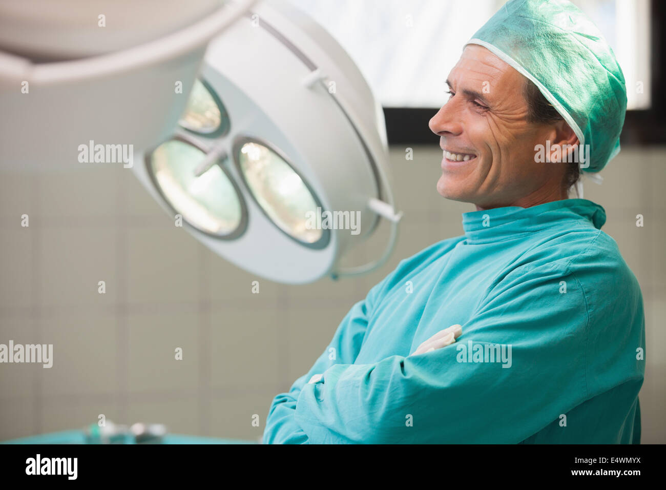 Happy surgeon sitting in a operating room Stock Photo - Alamy