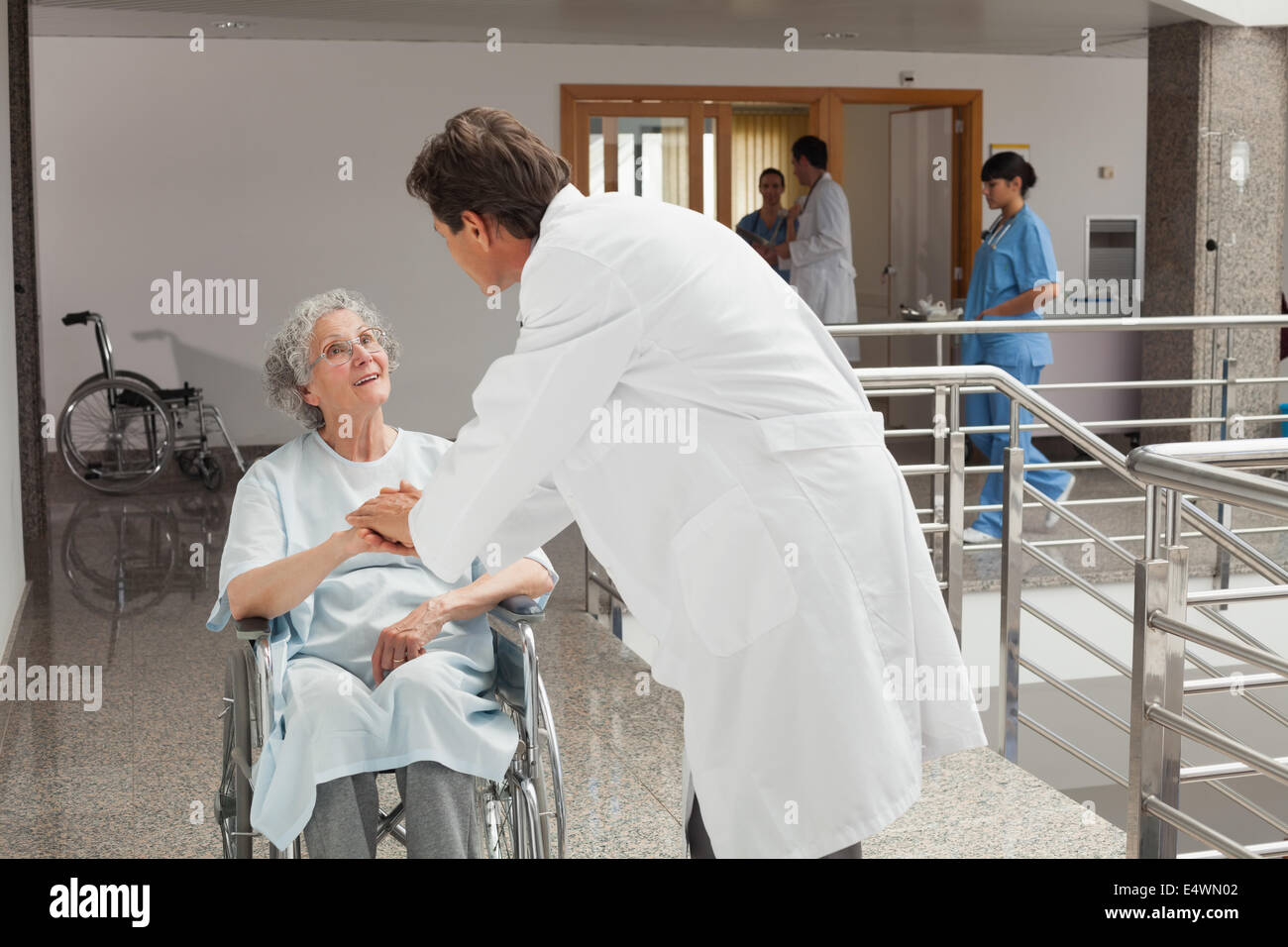 Doctor taking care of patient Stock Photo - Alamy