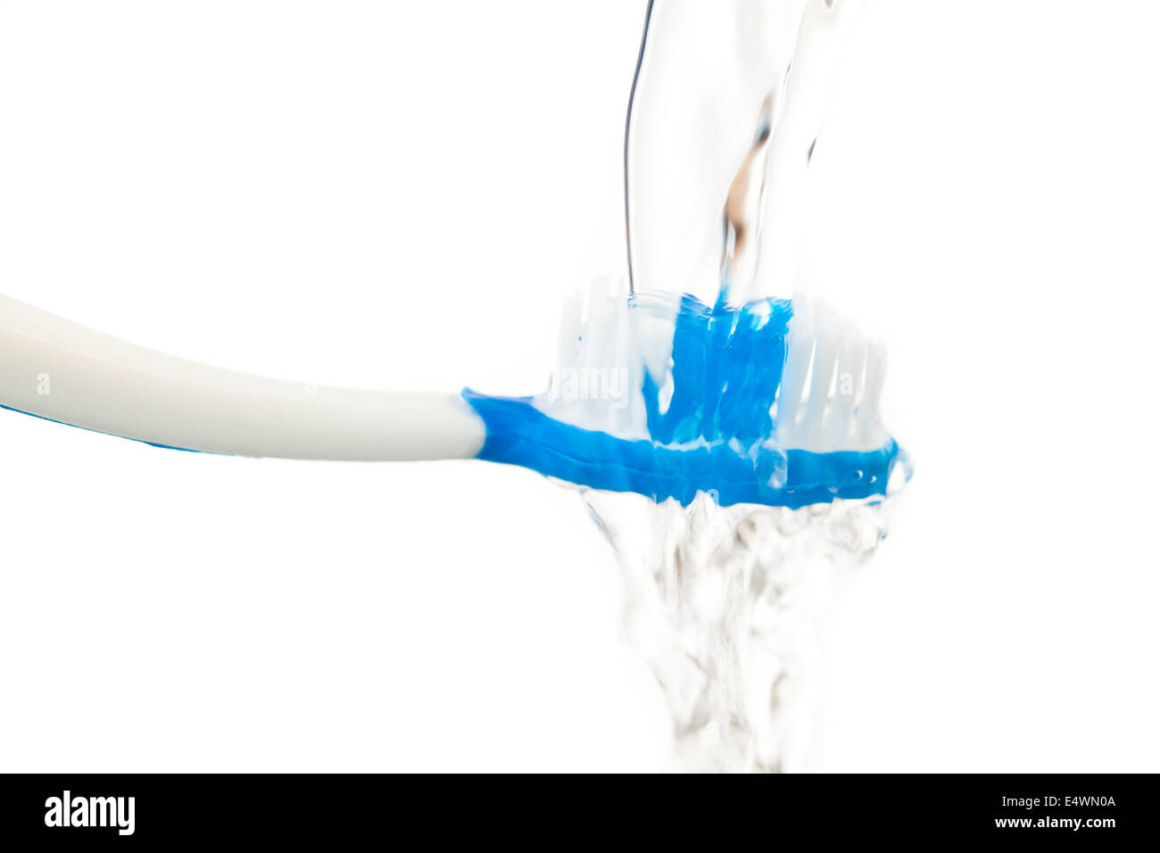 Water falling on toothbrush hi-res stock photography and images - Alamy