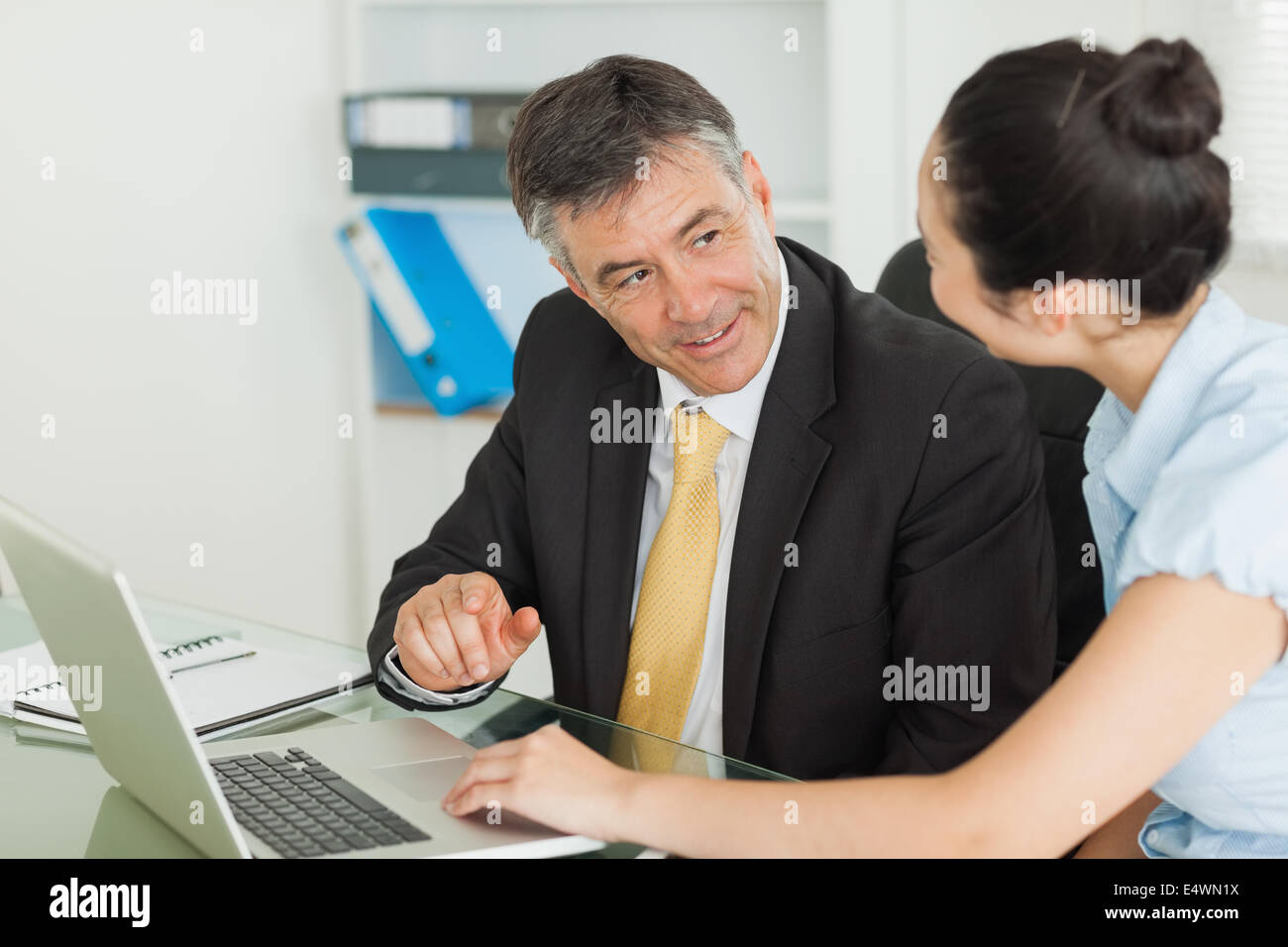 Business man and woman working together Stock Photo - Alamy