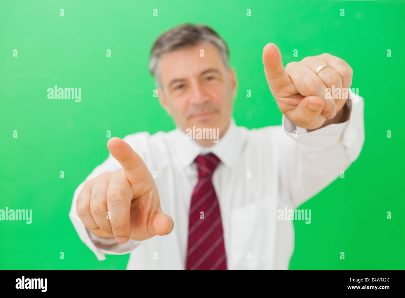 Man pointing with both hands Stock Photo - Alamy