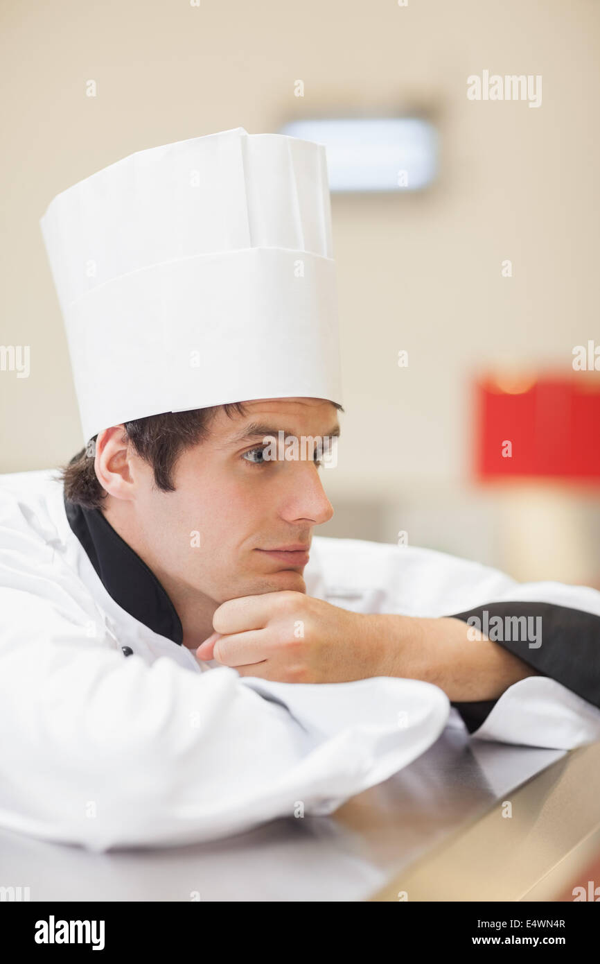 Thoughtful chef looking away Stock Photo - Alamy