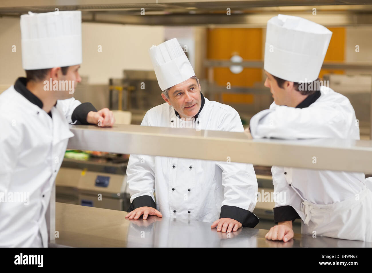 Three Chef's discussing Stock Photo - Alamy