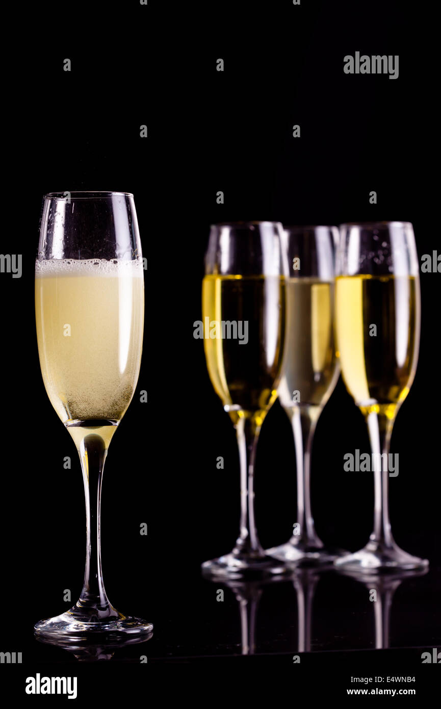 Four full flutes of champagne Stock Photo - Alamy