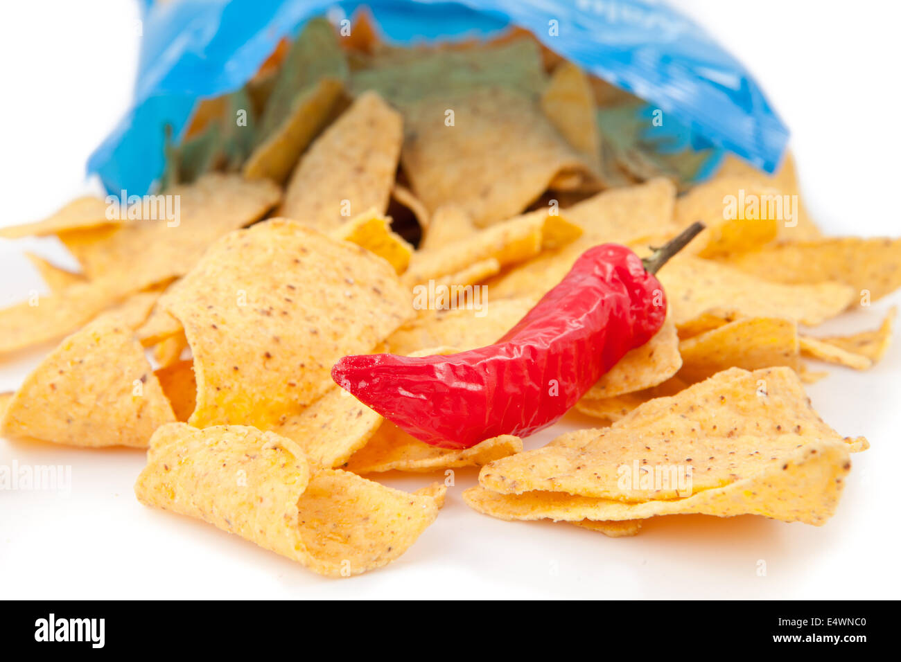 Open bag of crisps with a red pimento Stock Photo - Alamy