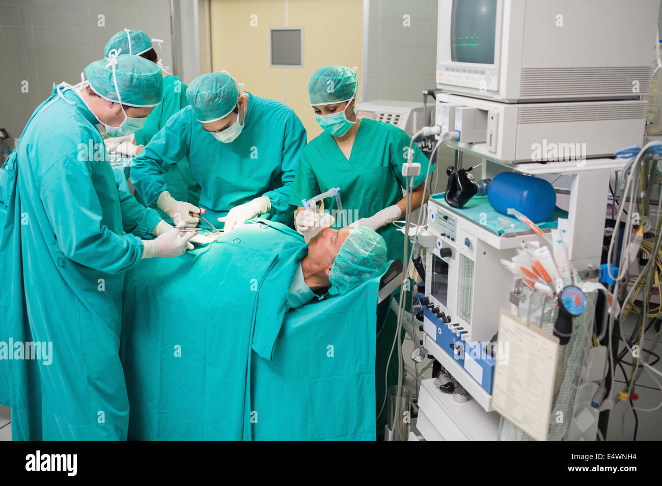 View of a medical team operating Stock Photo - Alamy