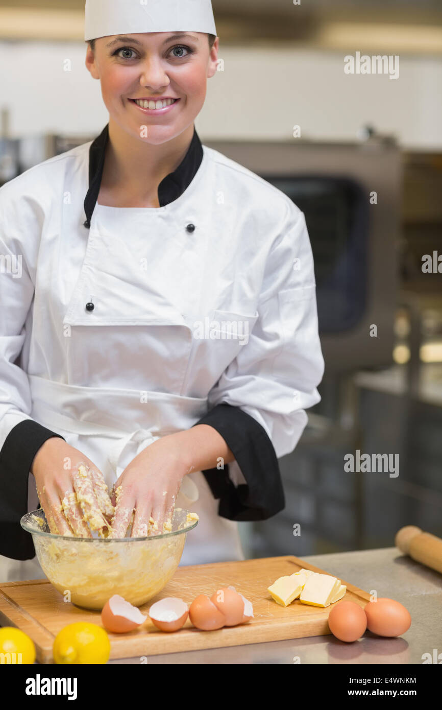 Smiling chef preparing the dough Stock Photo - Alamy
