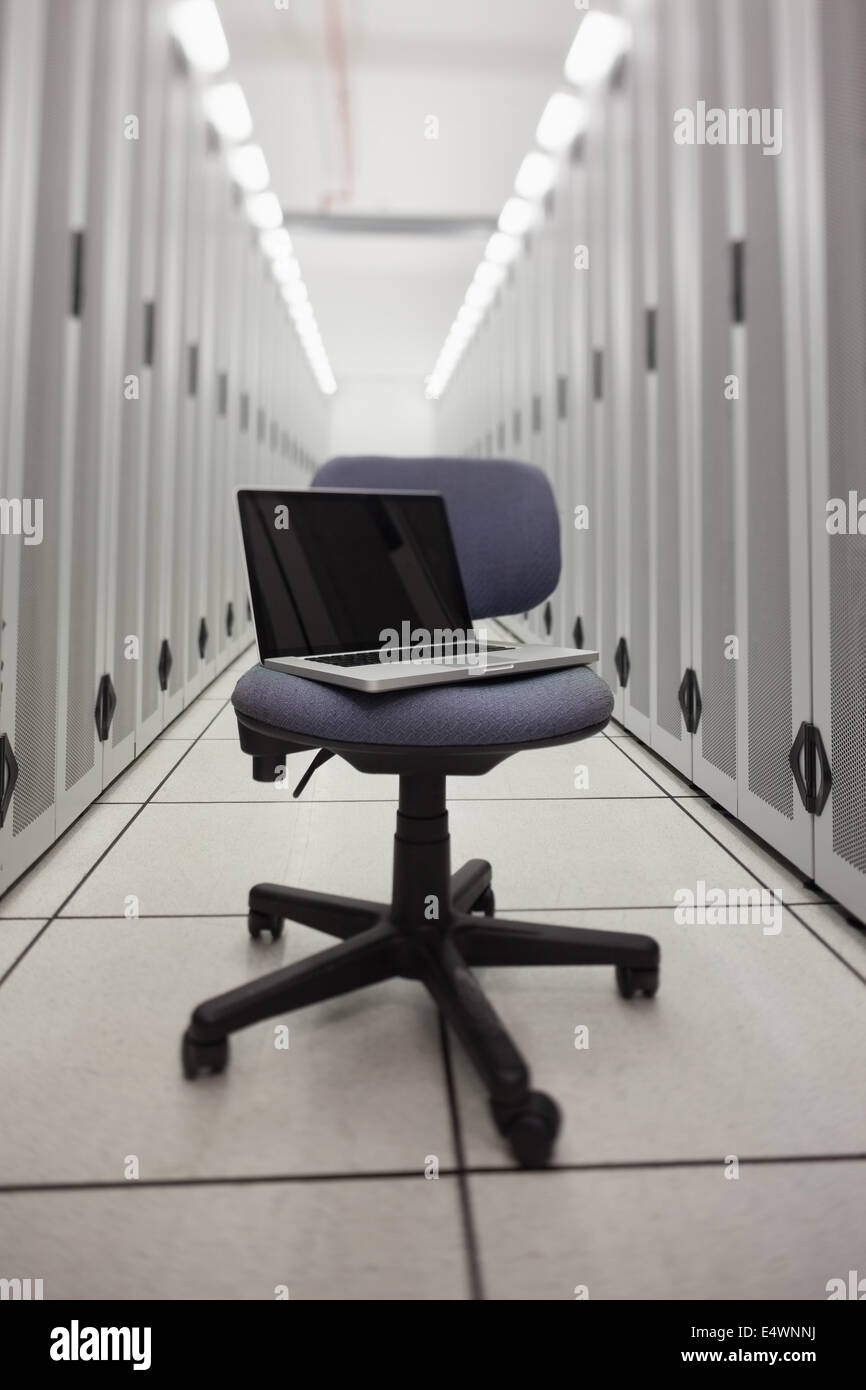 Laptop on a chair in hallway Stock Photo - Alamy