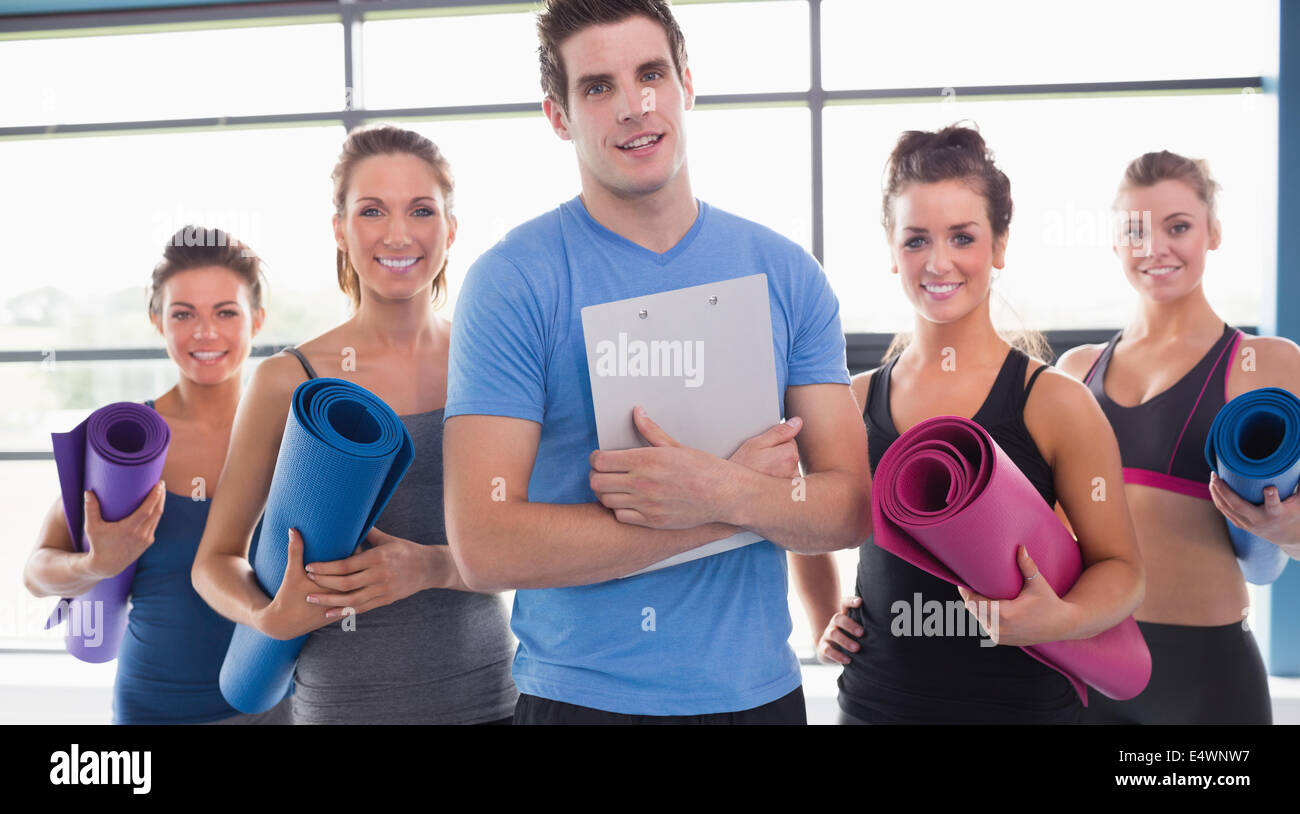 Yoga class with their trainer Stock Photo - Alamy