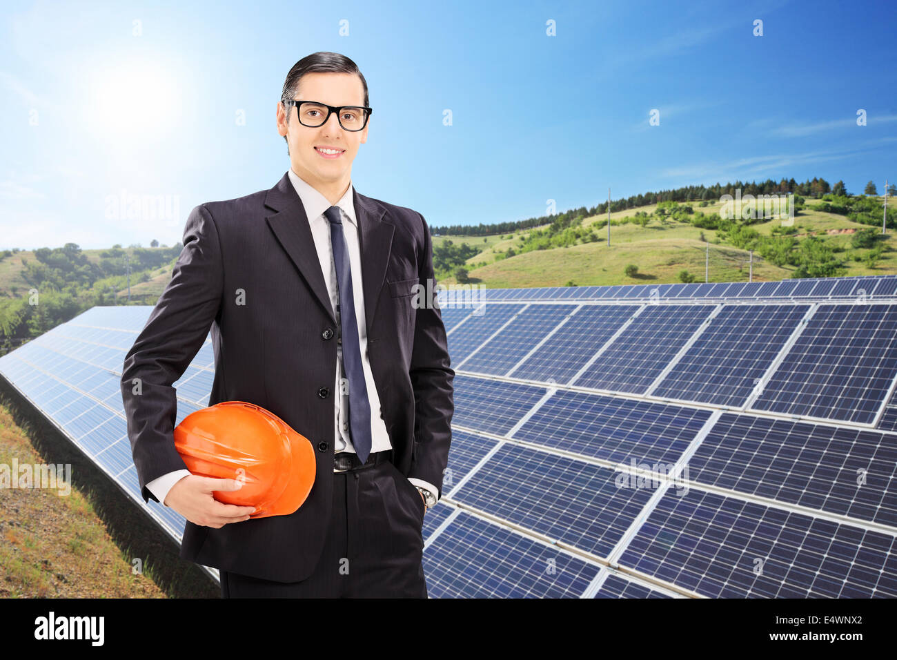 Construction worker in front of solar panels, outdoors Stock Photo - Alamy