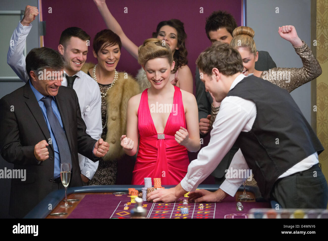 People cheering at roulette table Stock Photo - Alamy