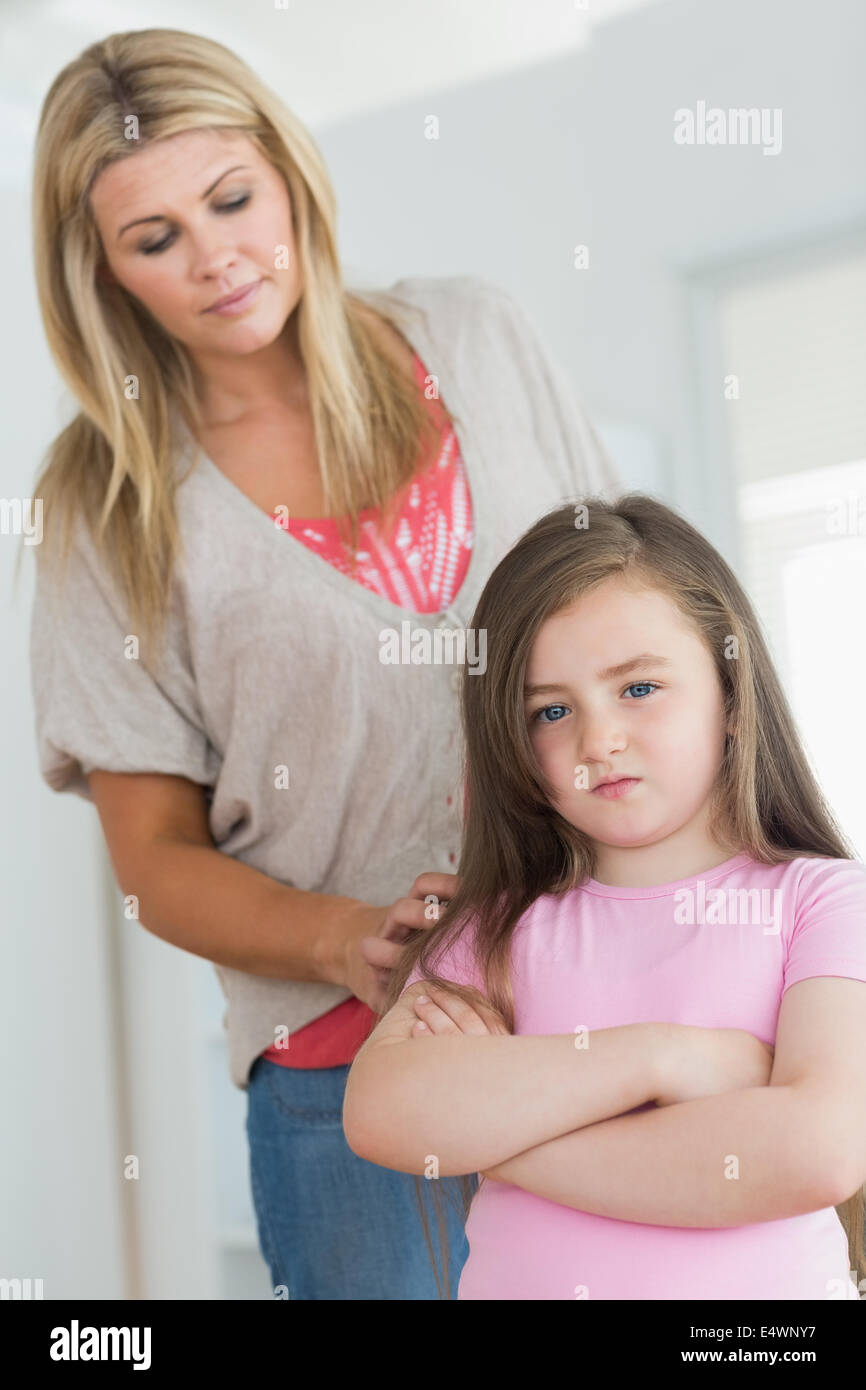 Mother trying to comfort angry daughter Stock Photo - Alamy