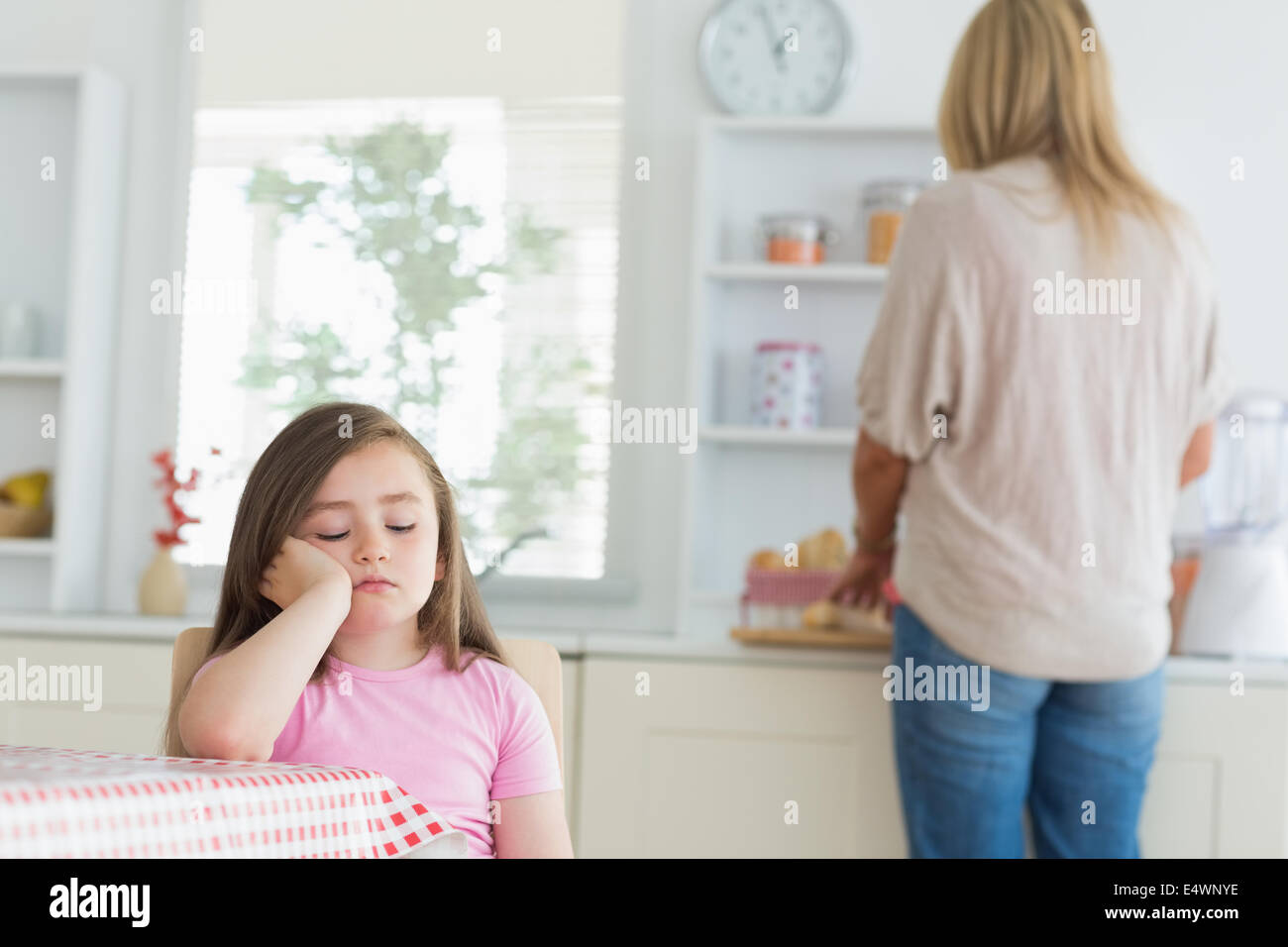 Child falling asleep at kitchen table Stock Photo - Alamy