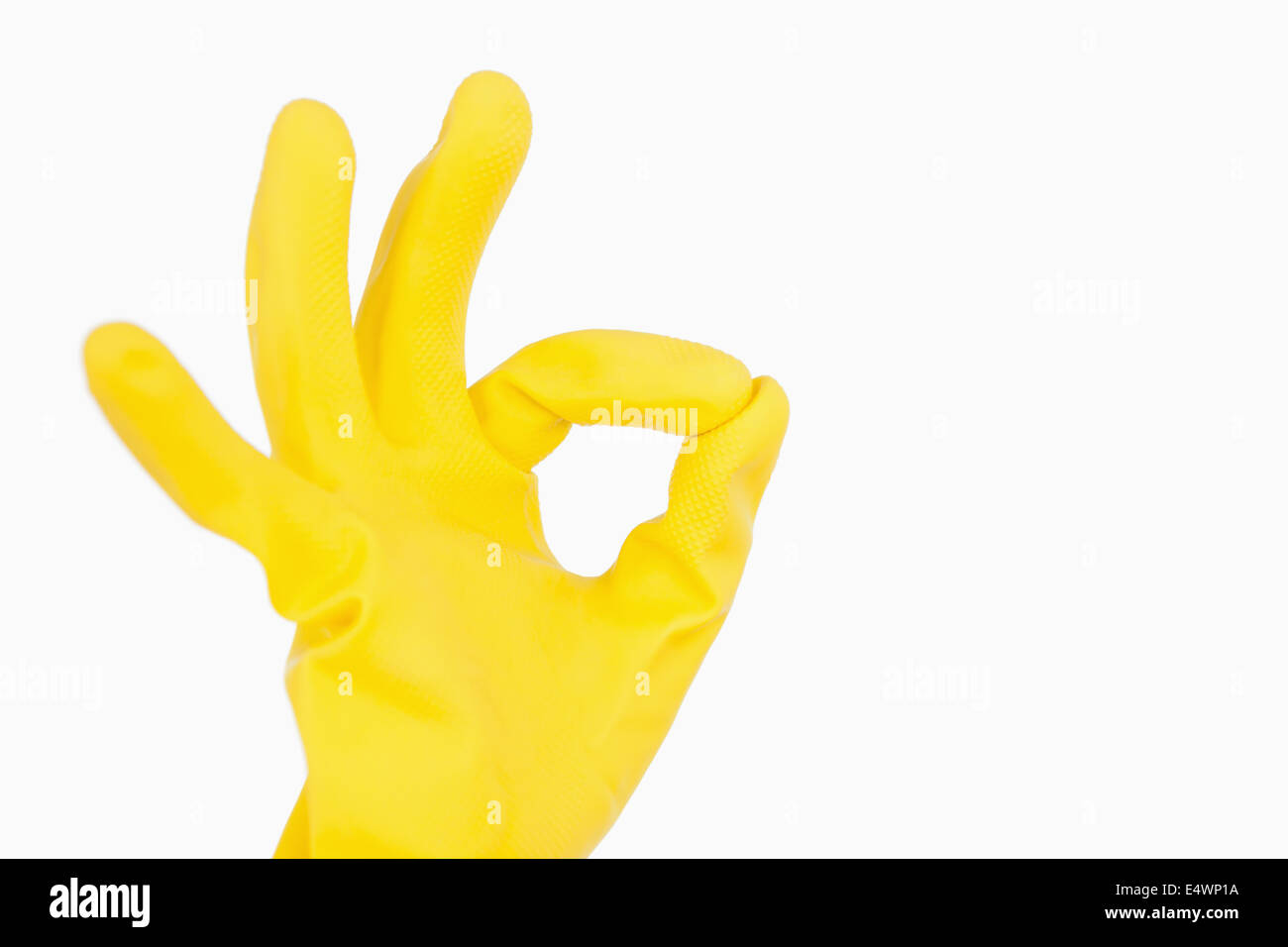 Hand in glove showing ok symbol Stock Photo - Alamy